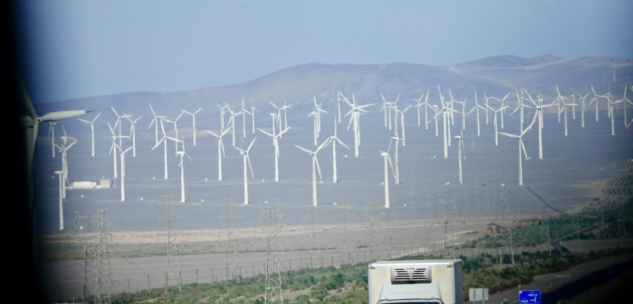 Thousands of wind turbines, electric coal trucks, transmission lines ...
